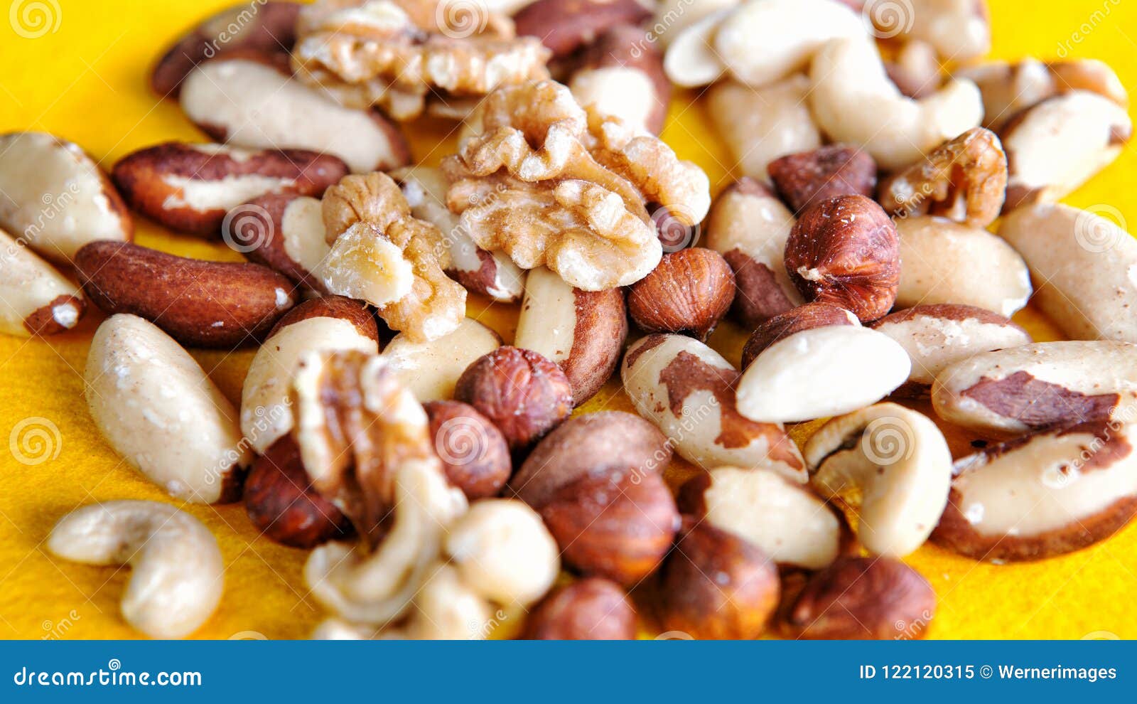 Group of Mixed Nuts on Yellow Plate Stock Image - Image of mixed, macro ...