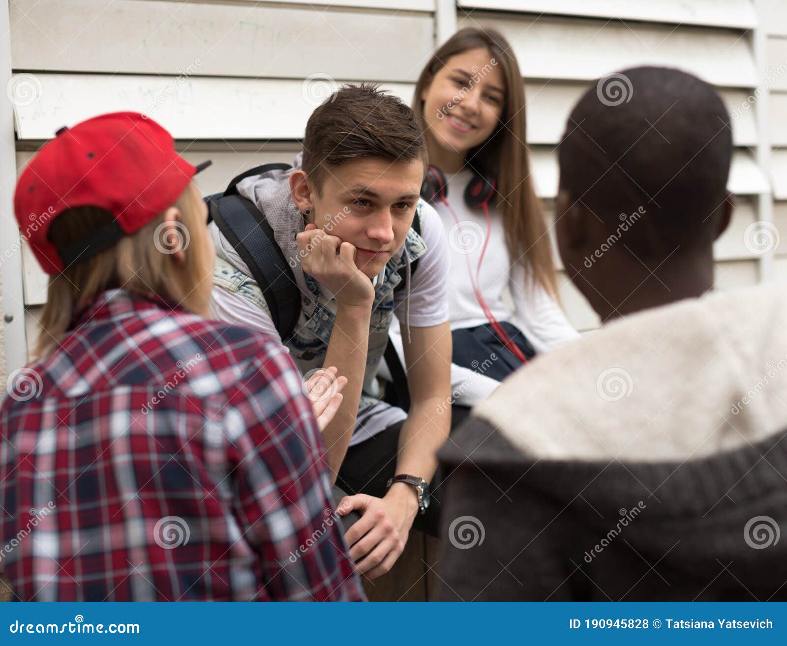 Group of Modern Teens Chatting in the Yard Stock Photo - Image of ...