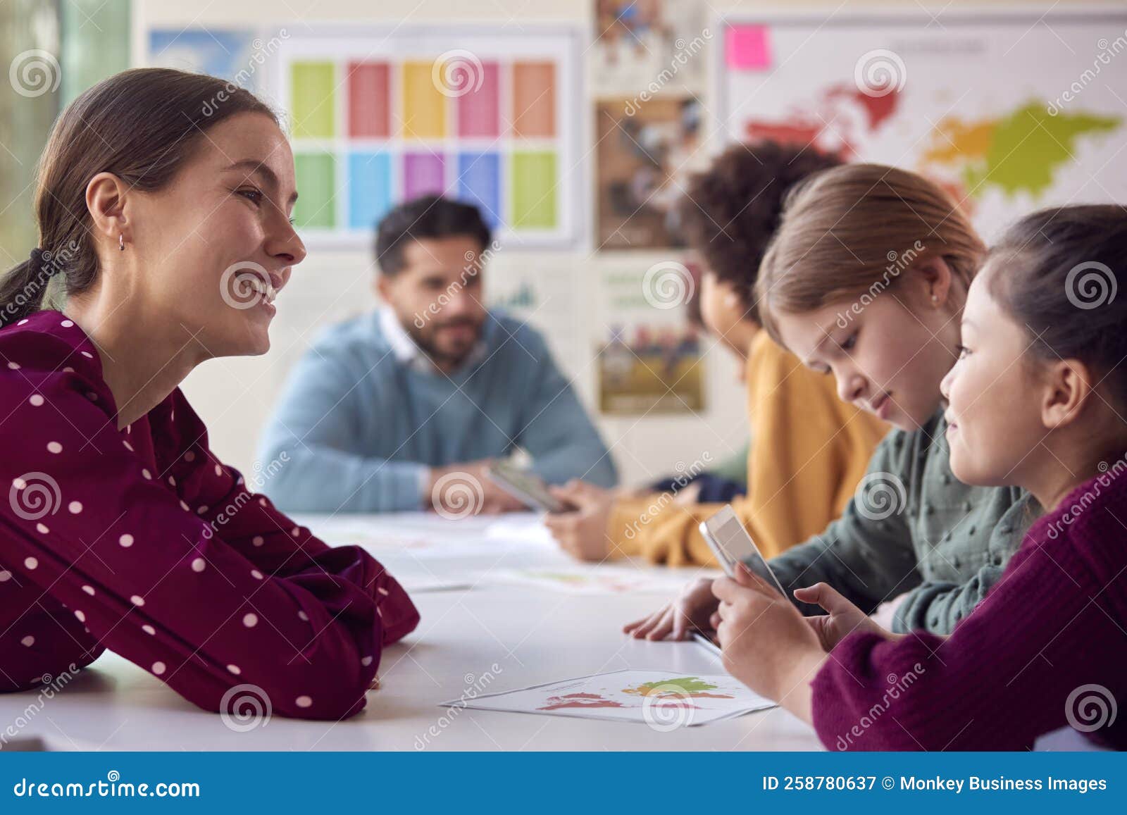 Group of Multi-Cultural Students with Teachers in Classroom Using ...