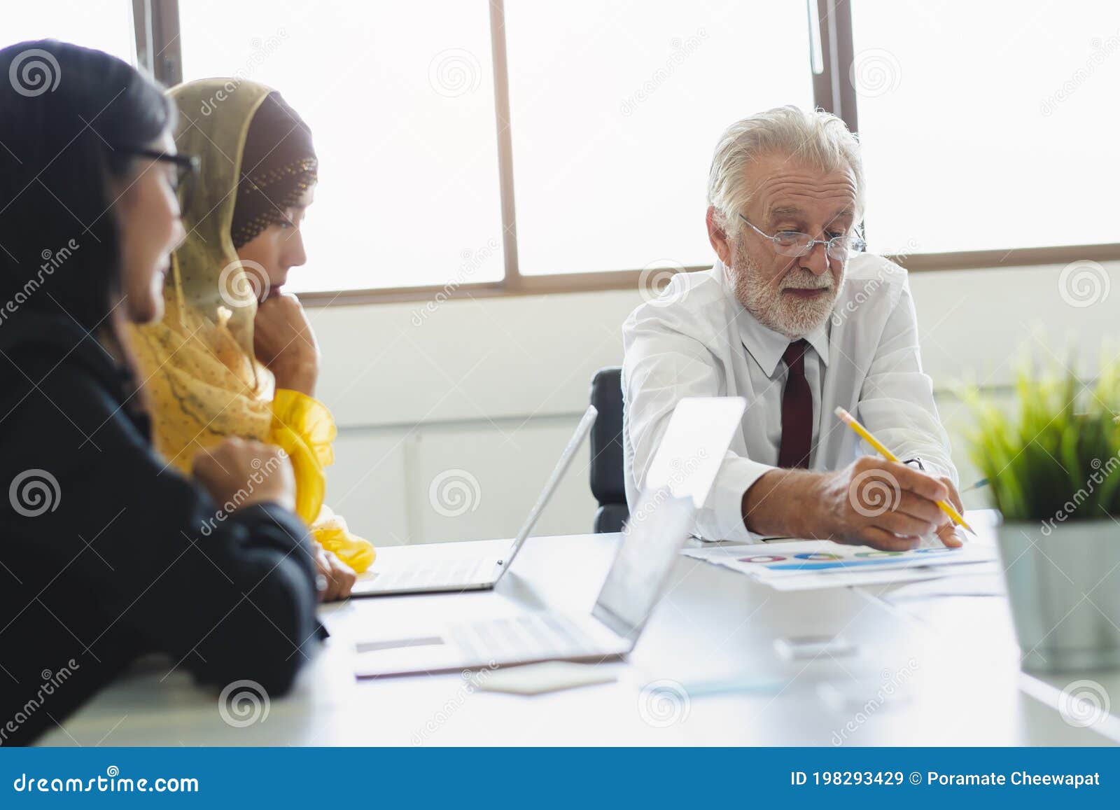 Group of Multi Ethnic Business People in the Meeting Room Reviewing ...