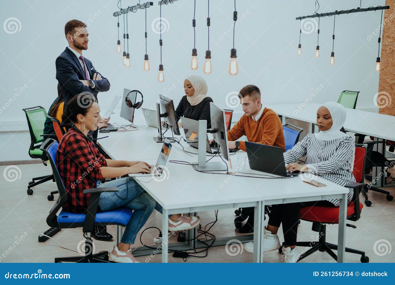 Group of Multi-ethnic Colleagues Working on Desktop Computers, Laptop ...