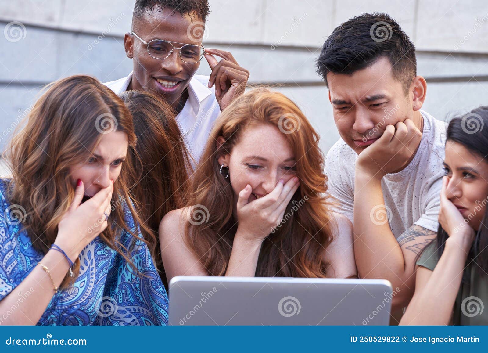 Group of Multi-ethnic People Look Shocked while Watching Something on ... Group of Multi-ethnic People Look Shocked while Watching Something on ...
