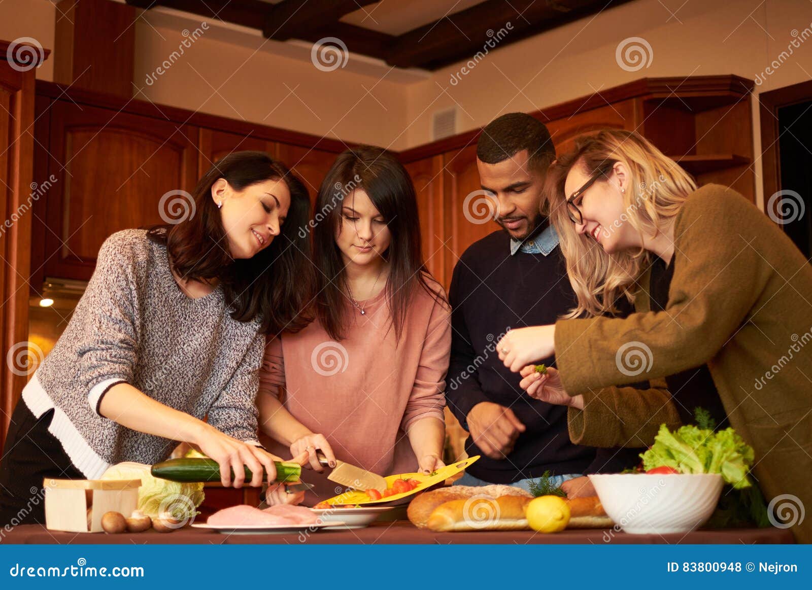 Group of Multi Ethnic Young Friends in Kitchen Prepare for Party Stock ...