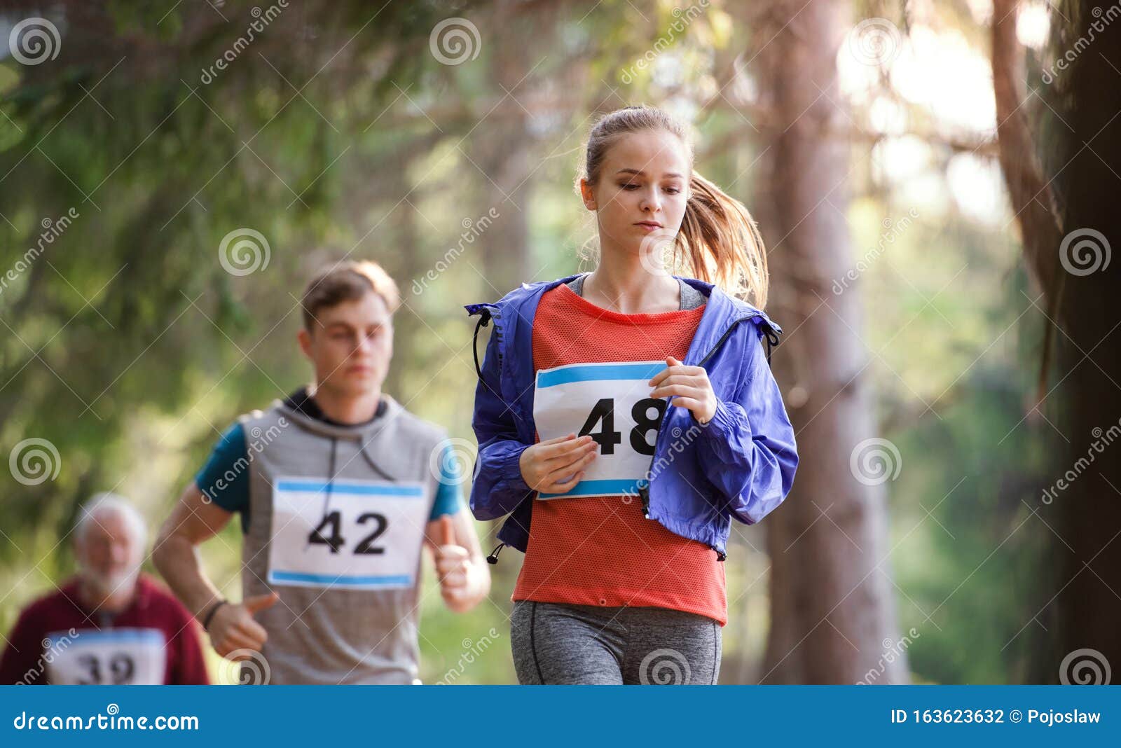 Group of Multi Generation People Running a Race Competition in Nature ...