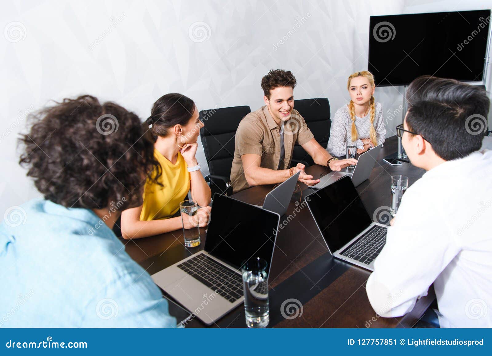 Group of Multicultural Business People Having Discussion at Table with ...