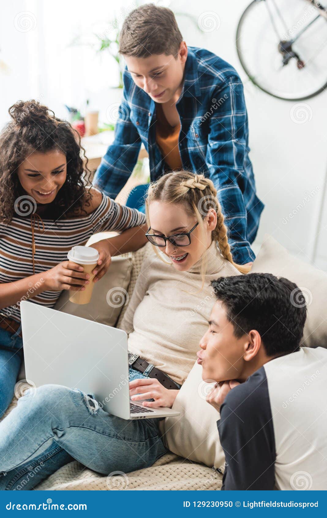 Group of Multicultural Teens Looking at Laptop Stock Photo - Image of ...