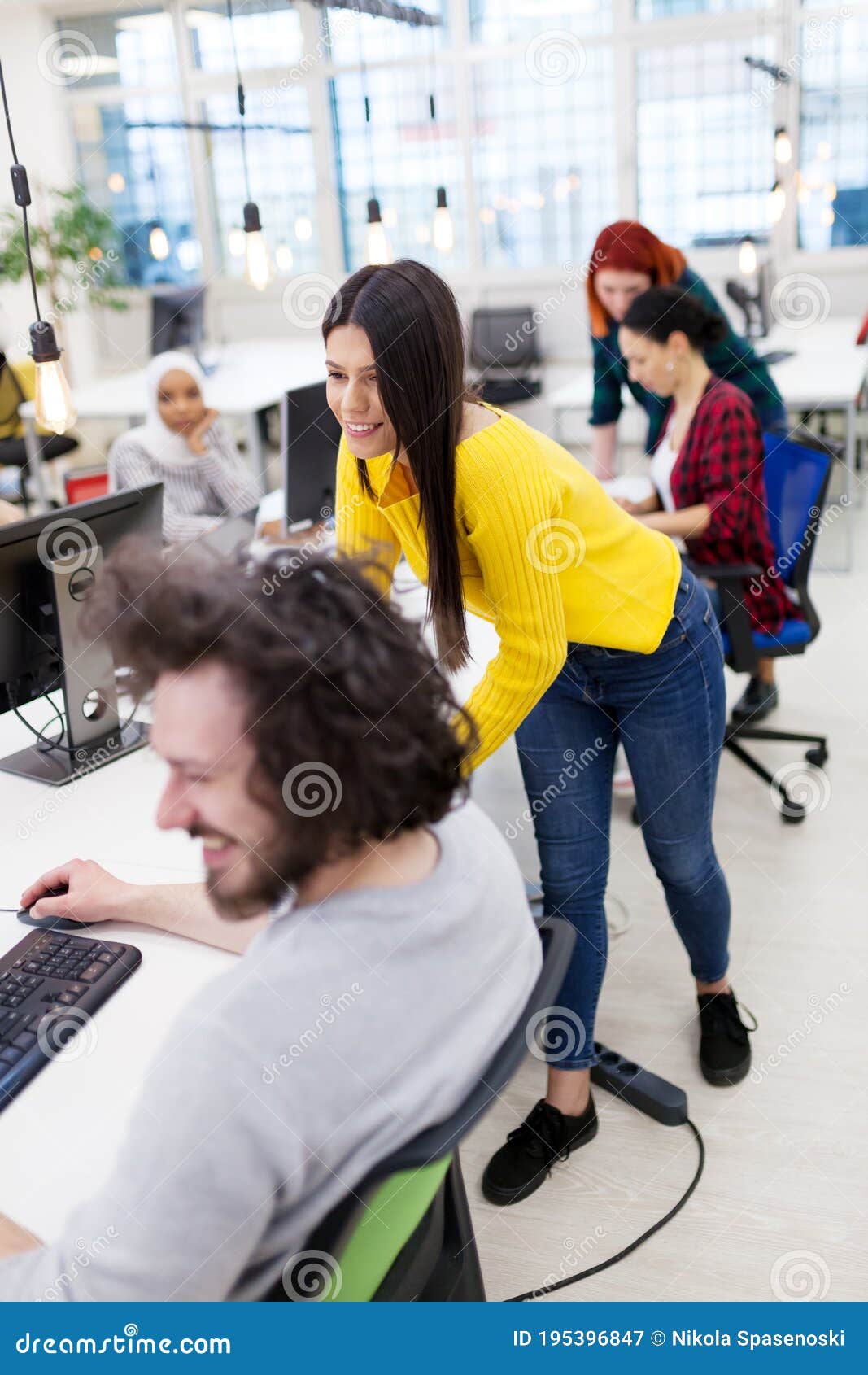 Group of Multiethnic Colleagues Working on Desktop Computers in a ...