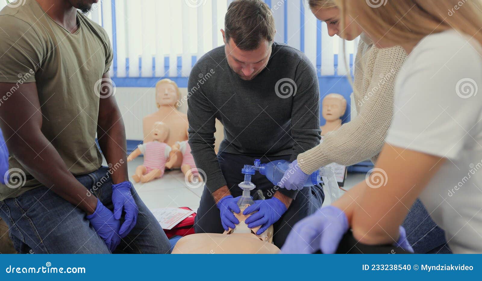 Group of Multiethnic People Learning How To Perform Cpr. Stock Photo ...