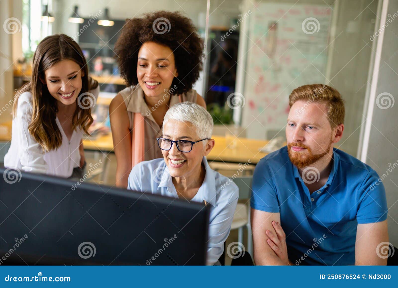 Group of Programmer Working in a Software Developing Company Office ...