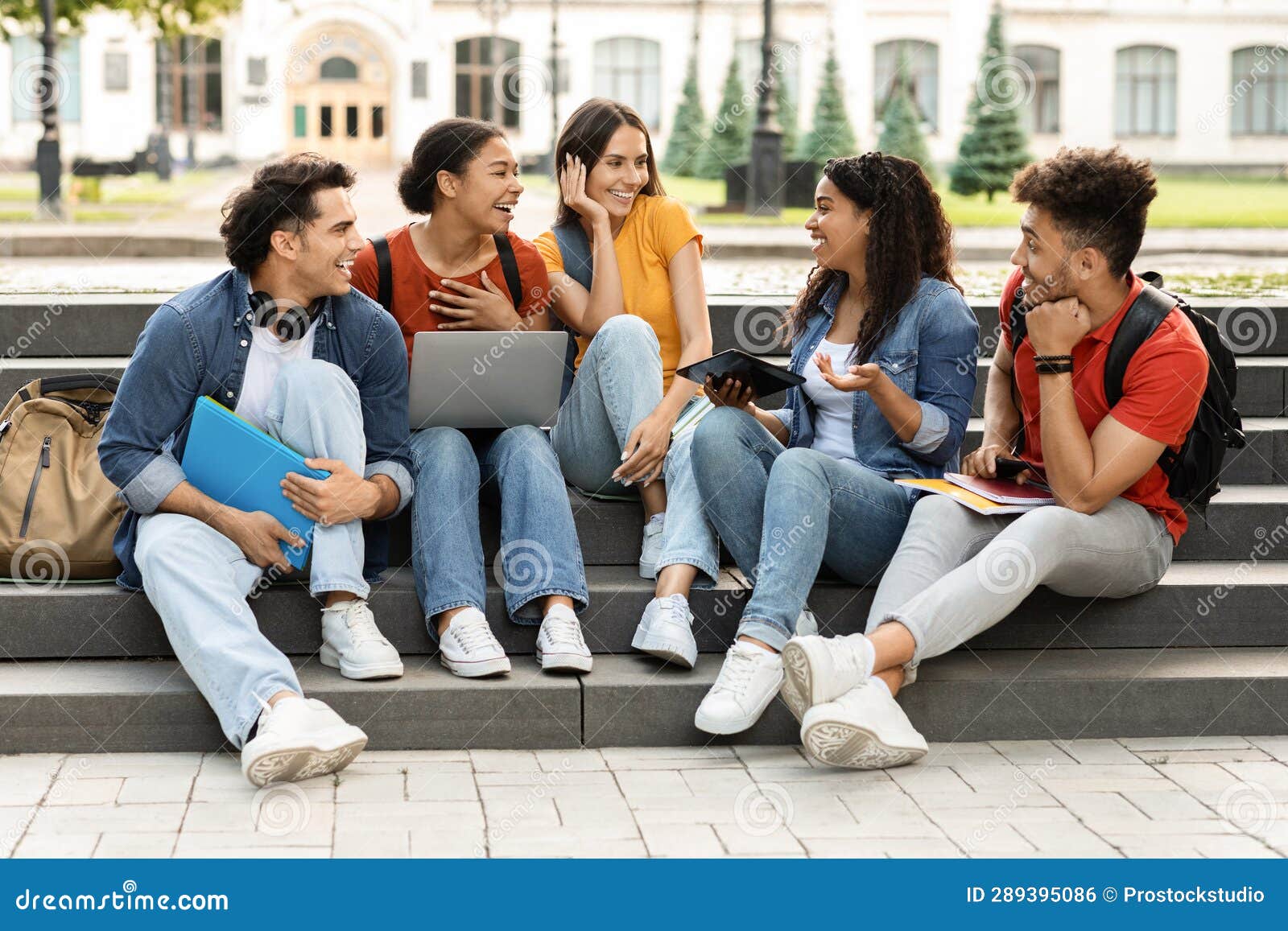Group of Multiethnic Students Chatting and Having Fun after Classes ...