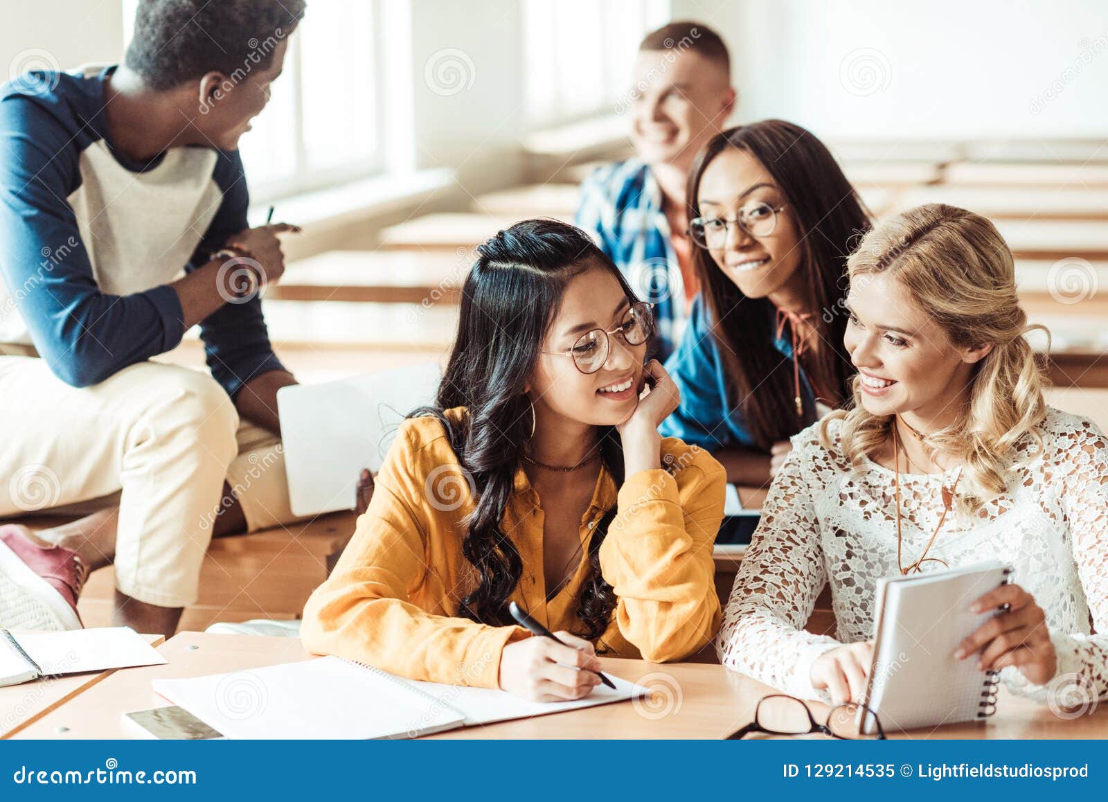 Group of Multiethnic Students Discussing Homework Stock Image - Image ... Group of Multiethnic Students Discussing Homework Stock Image - Image ...