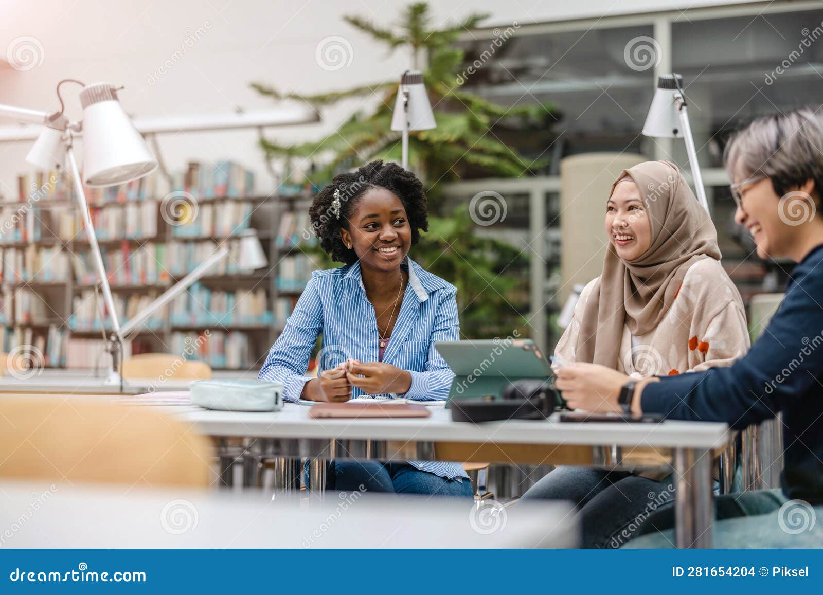 Group of Multiethnic Students in a Library Stock Photo - Image of exam ...