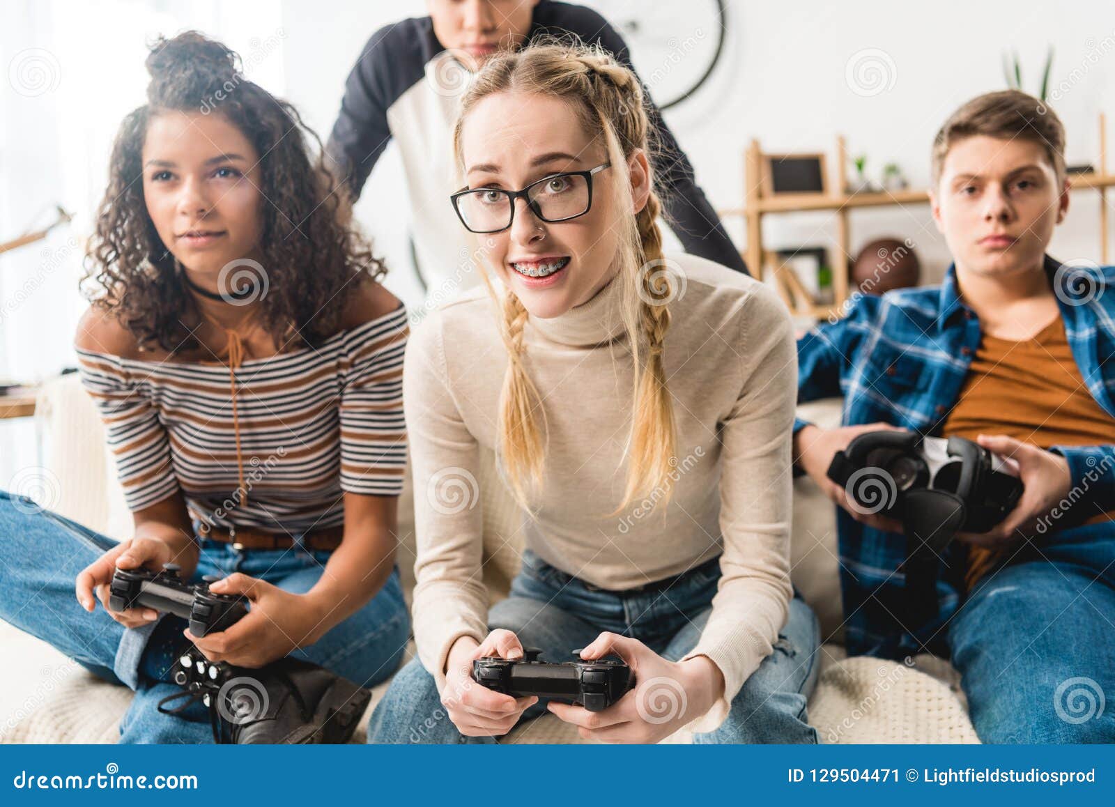 Group of Multiethnic Teens Playing Video Game Stock Image - Image of ...