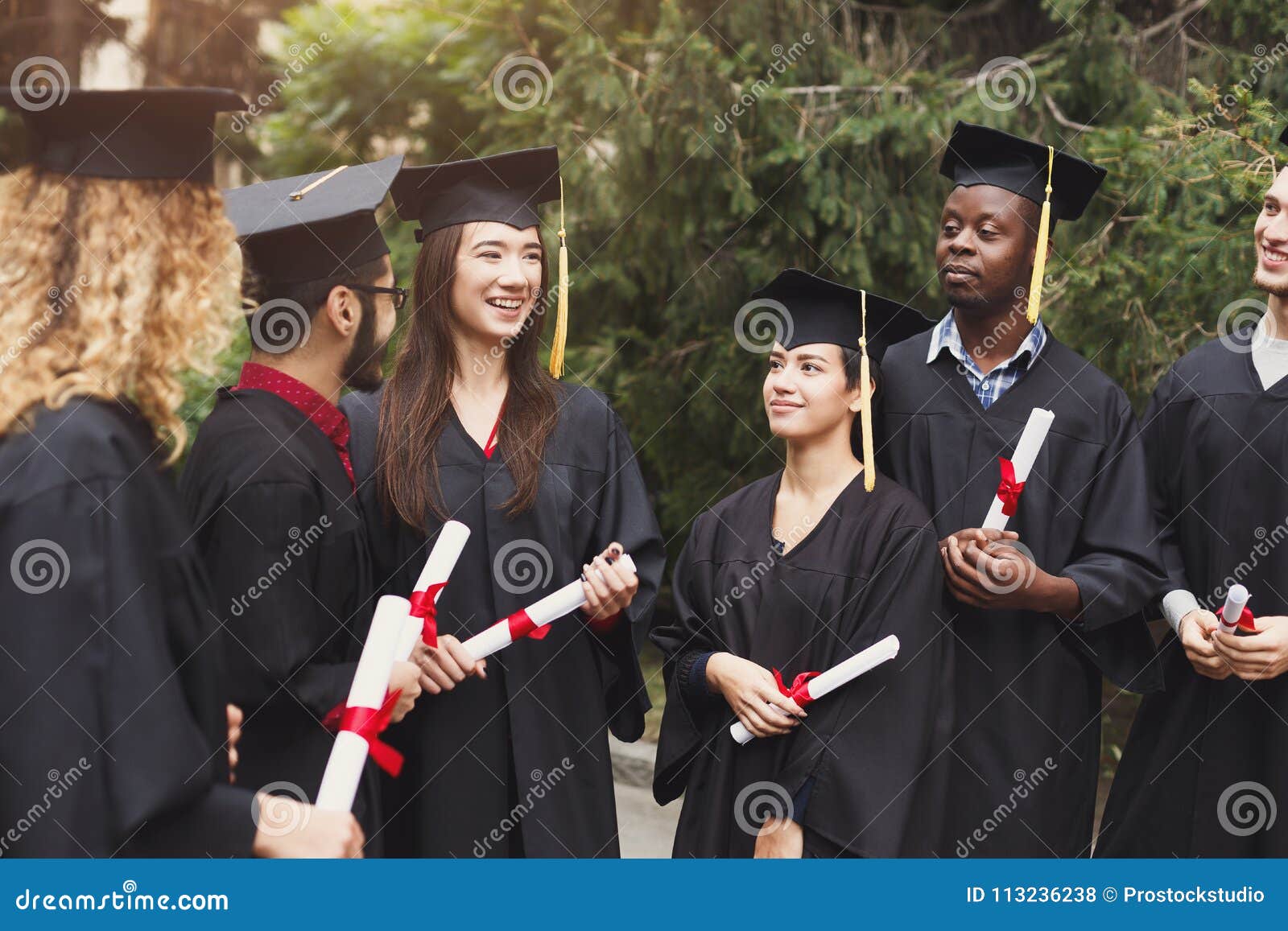 A Group of Graduates Celebrating Stock Photo - Image of ceremonious ...