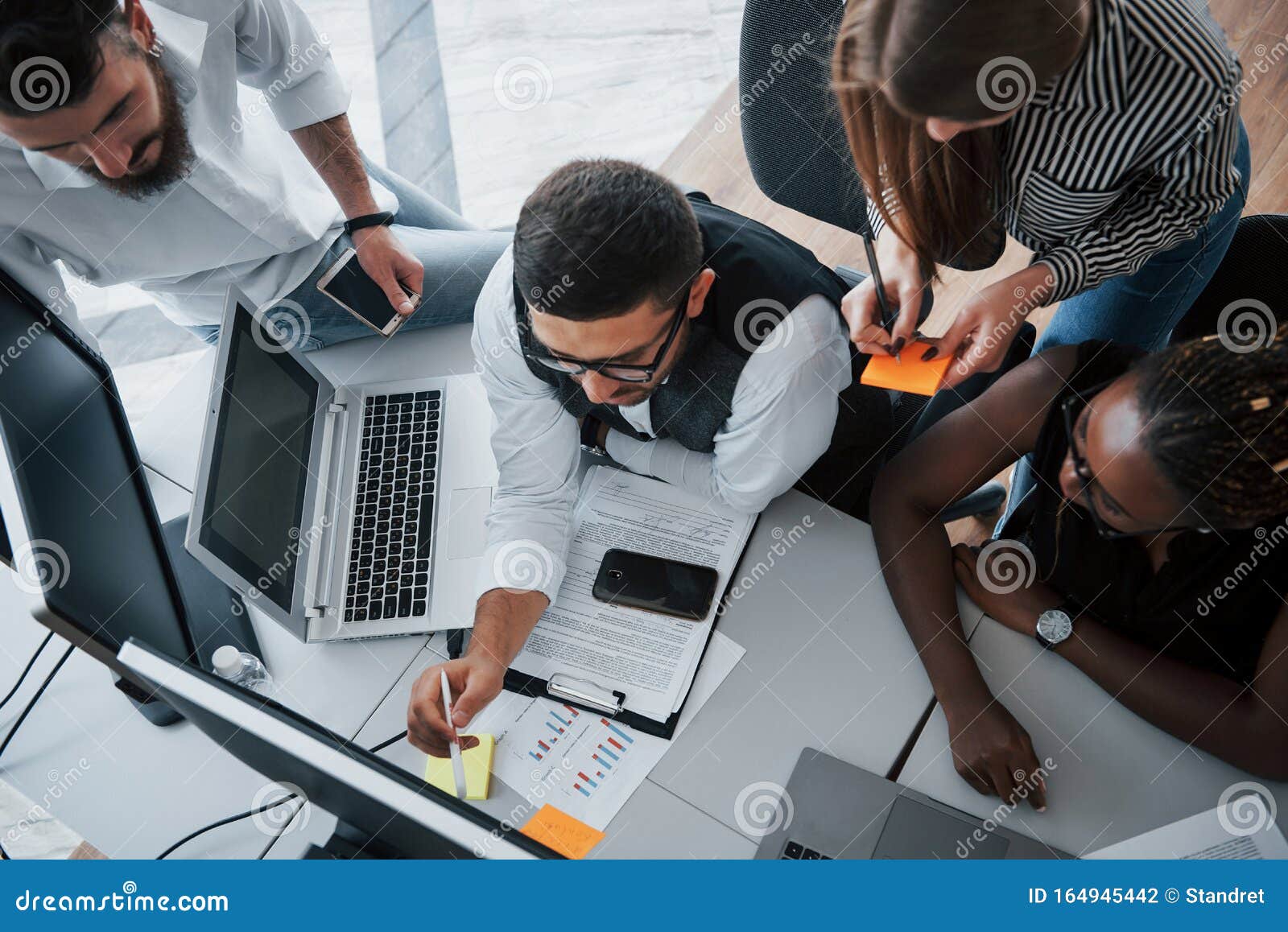A Group of Multinational Busy People Working in the Office. Stock Photo ...