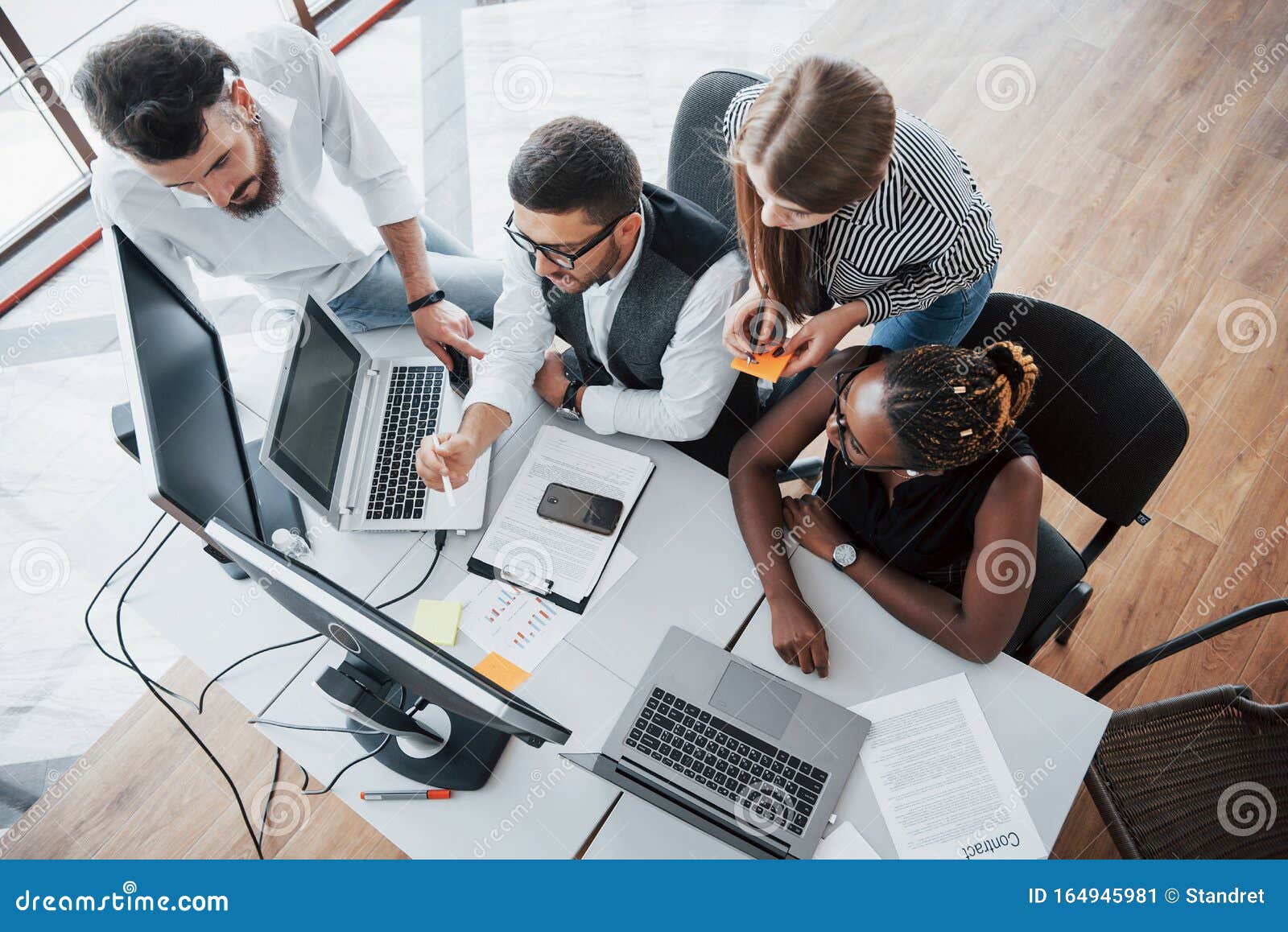 A Group of Multinational Busy People Working in the Office. Stock Image ...