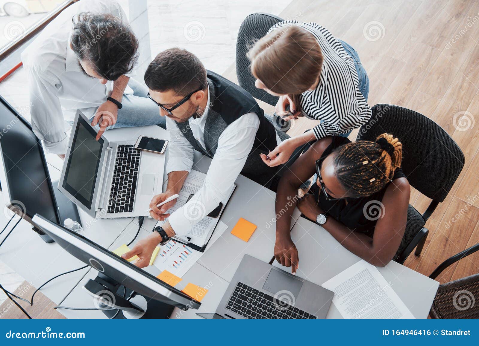 A Group of Multinational Busy People Working in the Office. Stock Photo ...