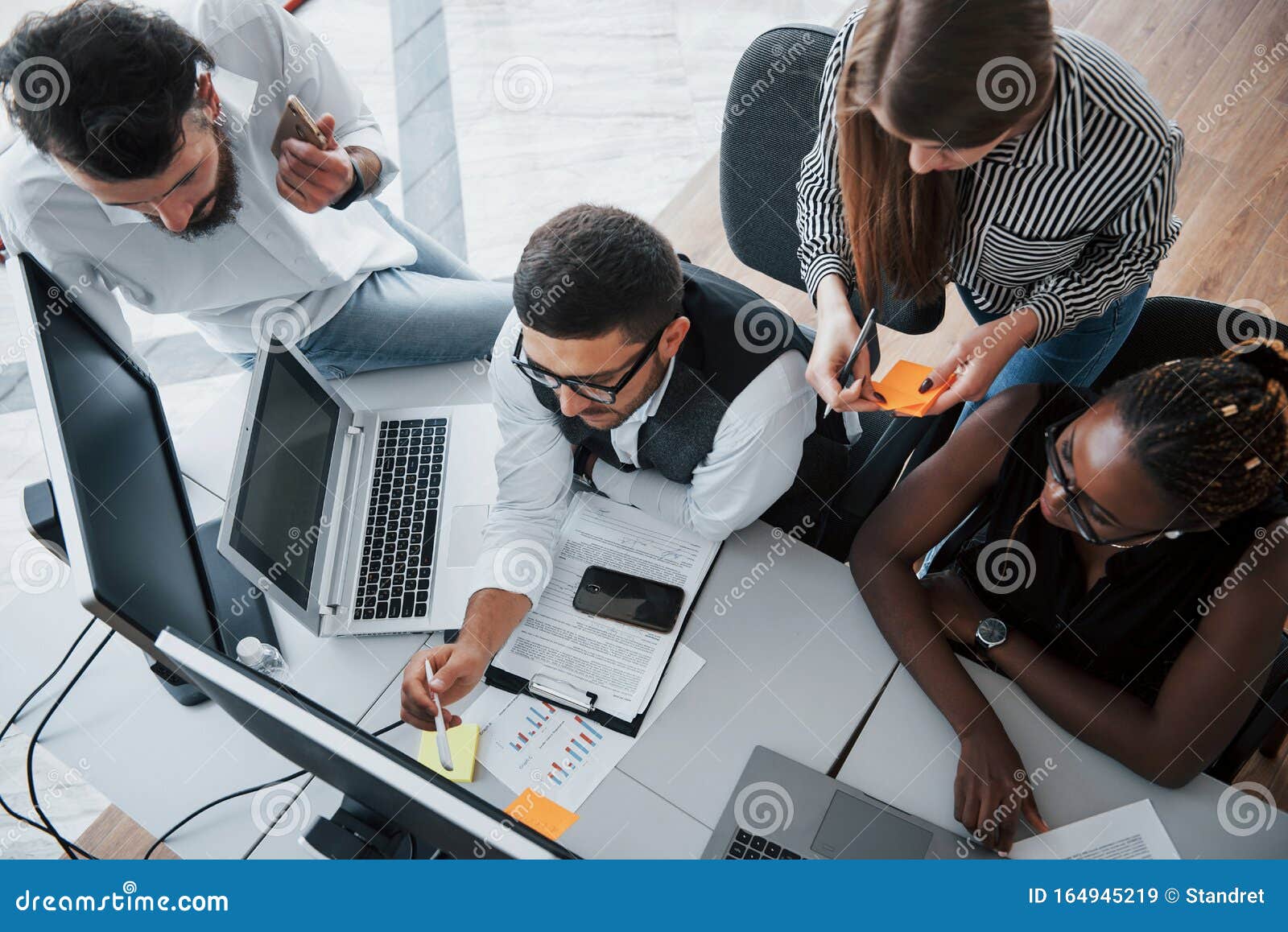 A Group of Multinational Busy People Working in the Office. Stock Image ...