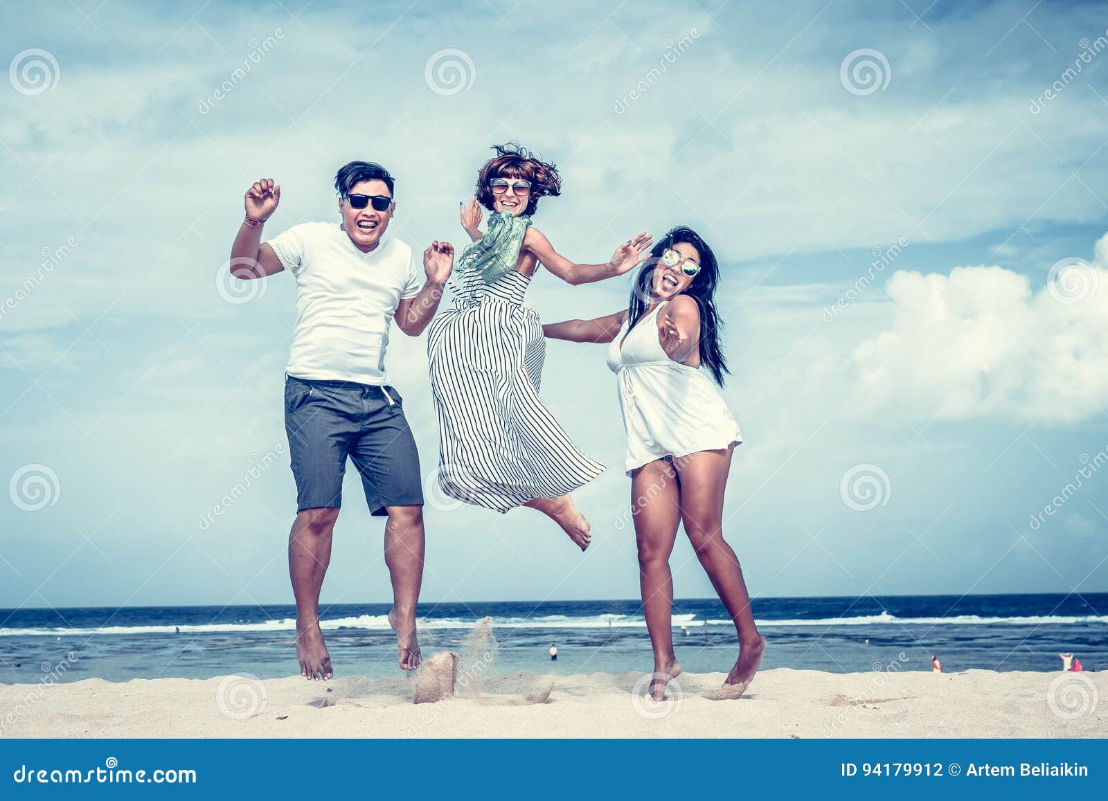 Group Of Multiracial Friends Having Fun On The Beach Of Tropical Bali