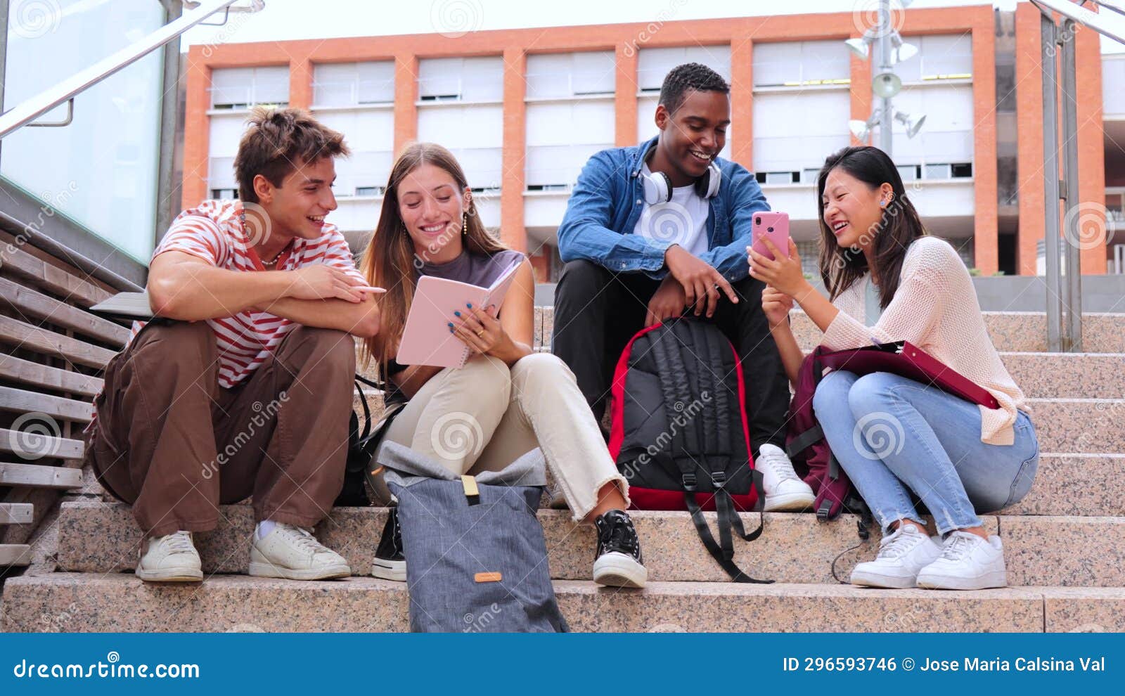 Group of Multiracial High School Students Talking on a Staircase at ...