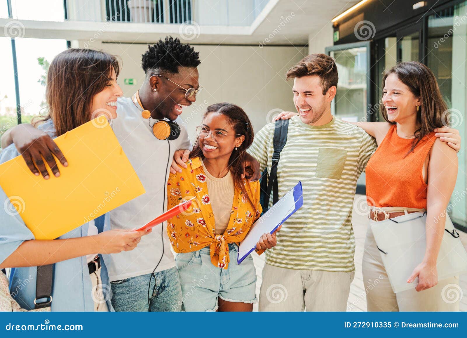 Group of Multiracial Students Talking and Smiling after Class at ...