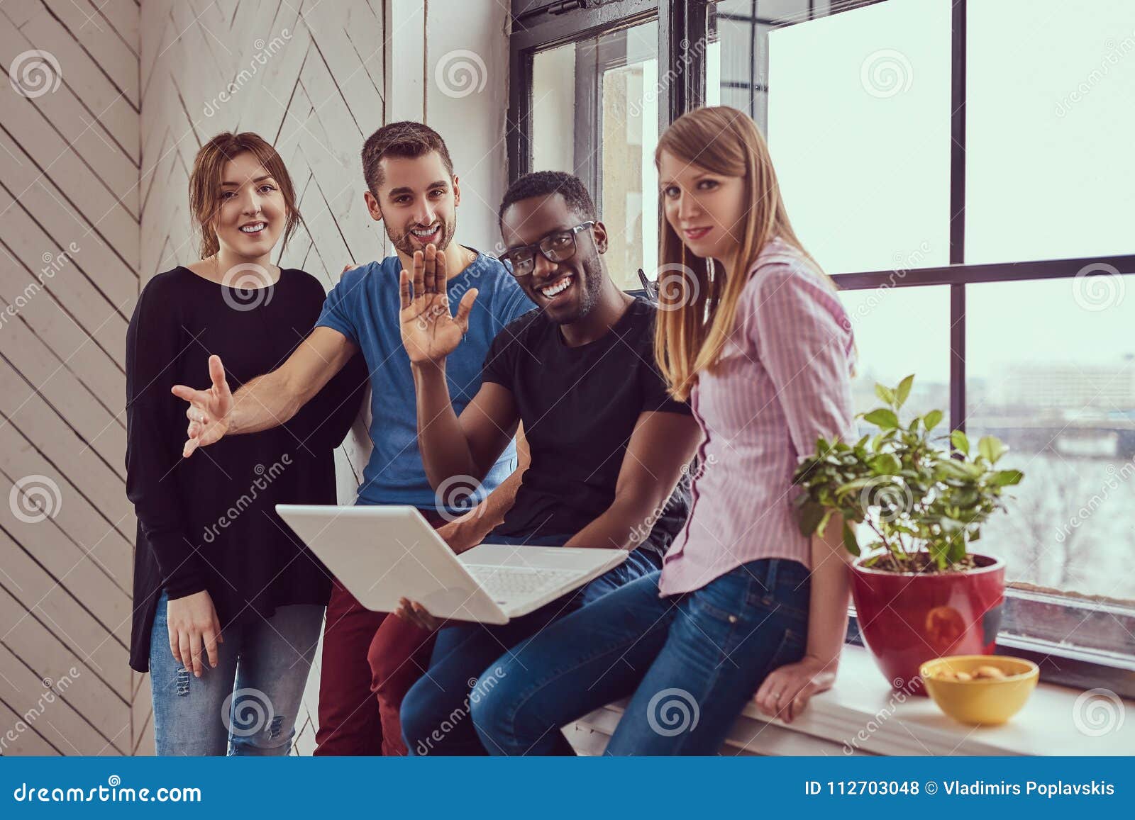 Group of Multiracial Students Working with a Laptop. Stock Photo ...