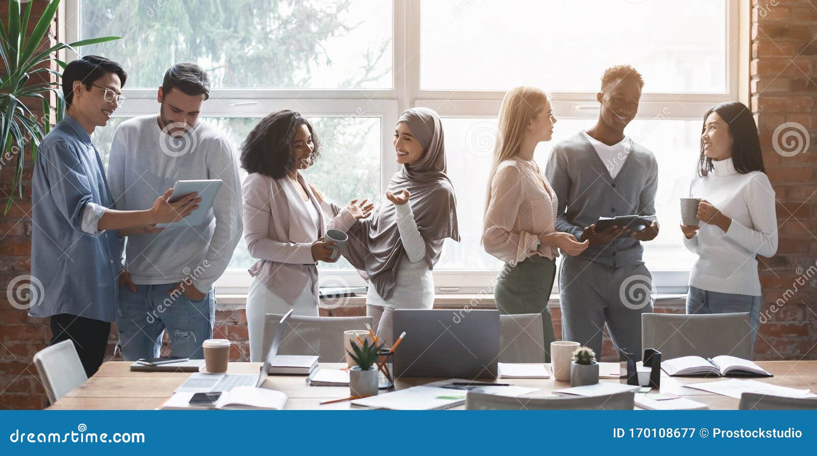 Group of Multiracial Young People Sharing Ideas while Coffe Break Stock ...