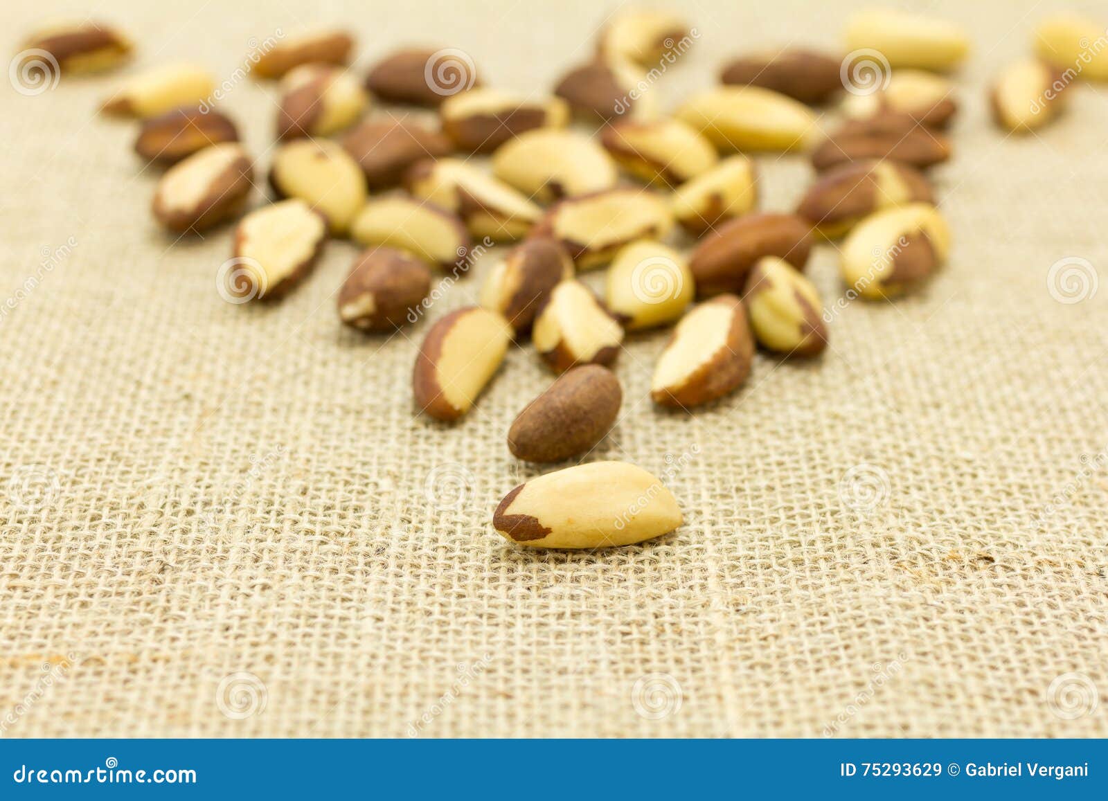 Group of Nuts Forming a Triangle, Over Jute Fabric Stock Image - Image ...
