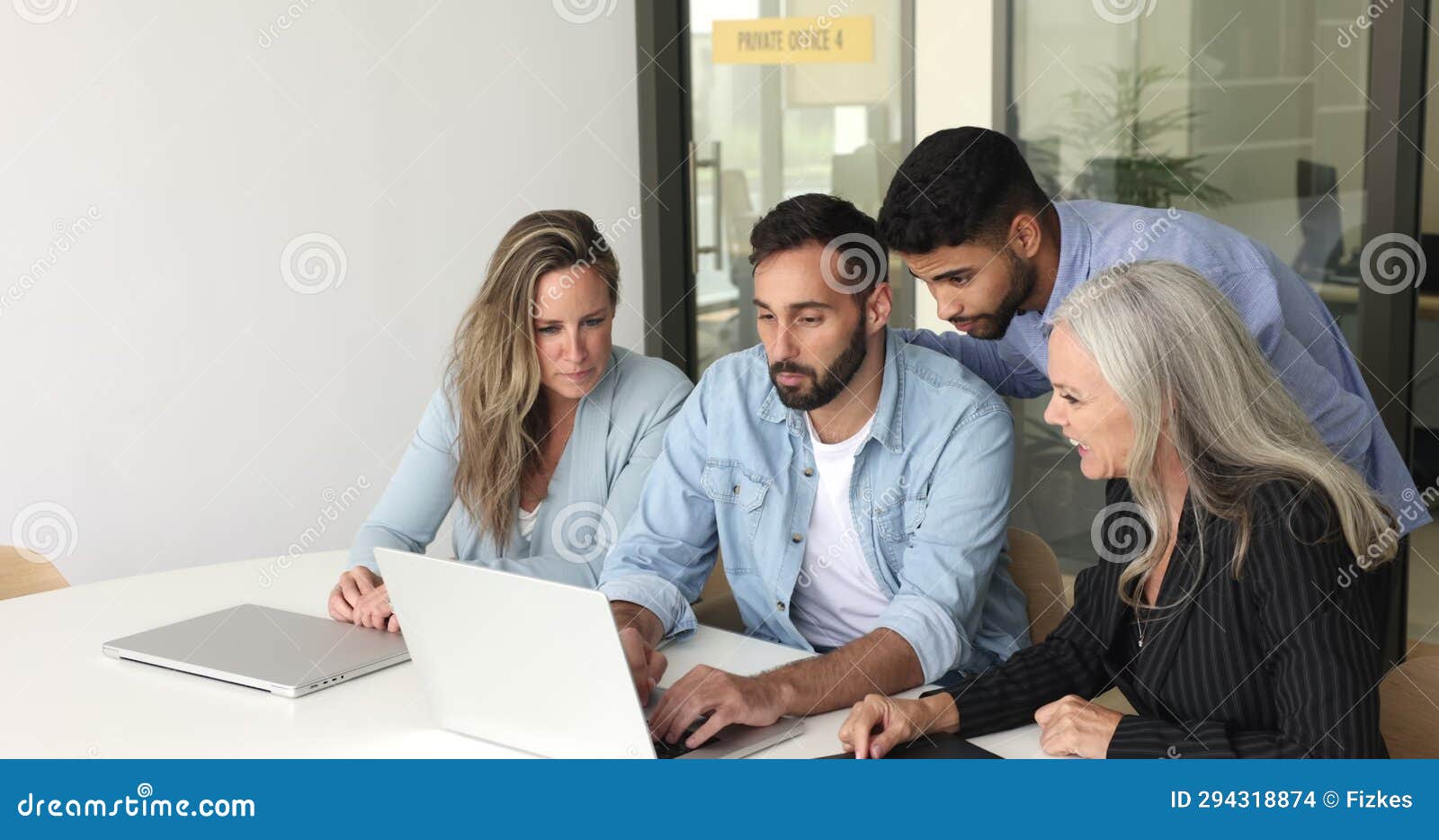 Group of Office Employees Working Together Using Laptop Stock Footage ...