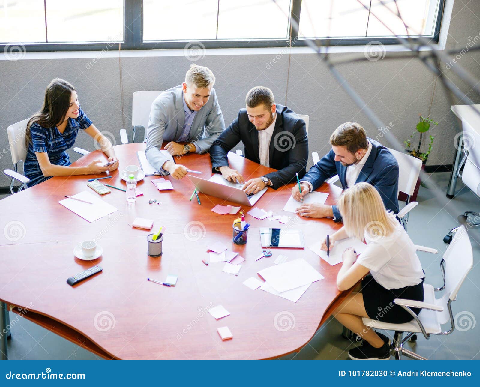 A Group of Office Workers Work at the Desk in the Office Stock Photo ...