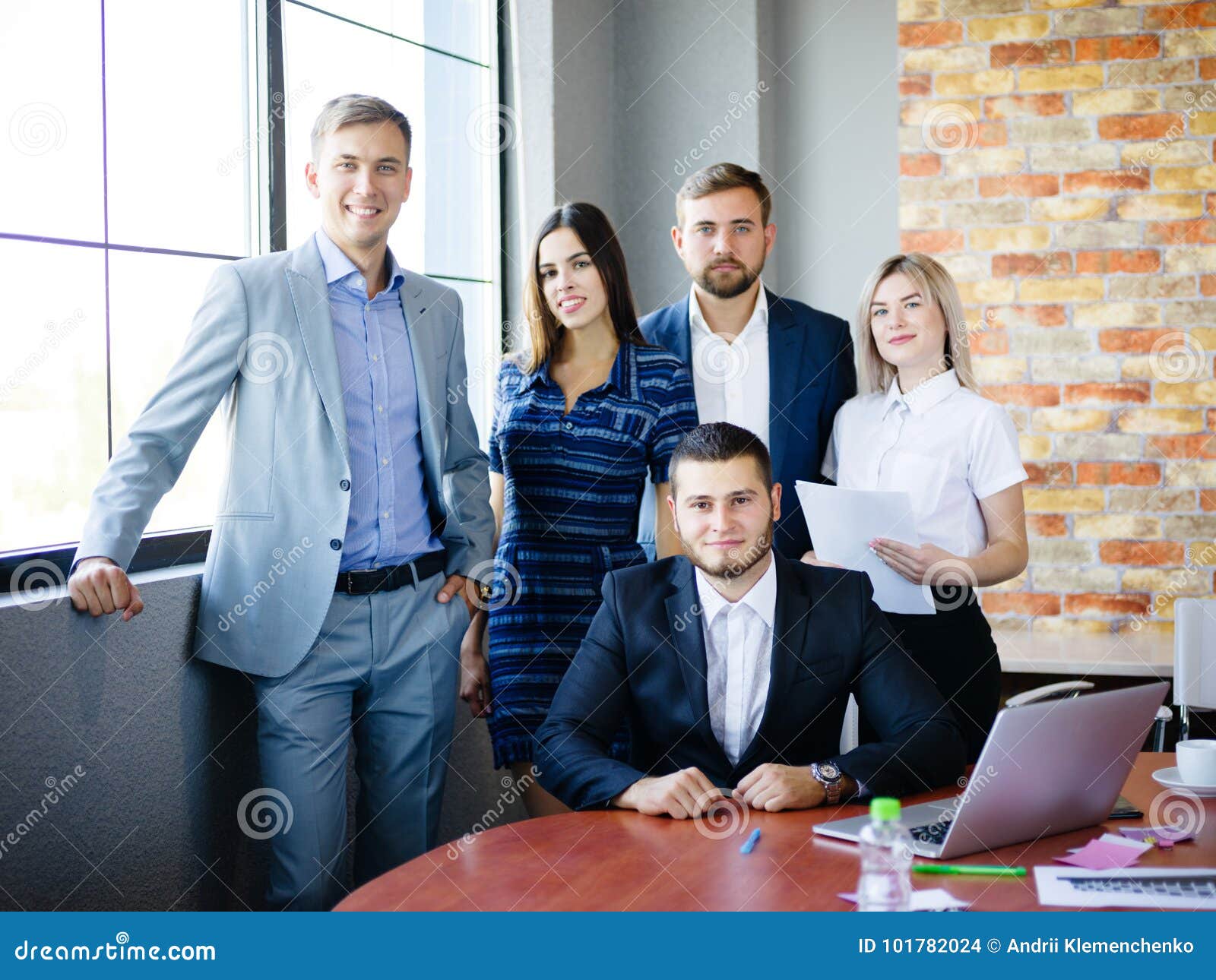 A Group of Office Workers Examining Ideas in Office Stock Photo - Image ...