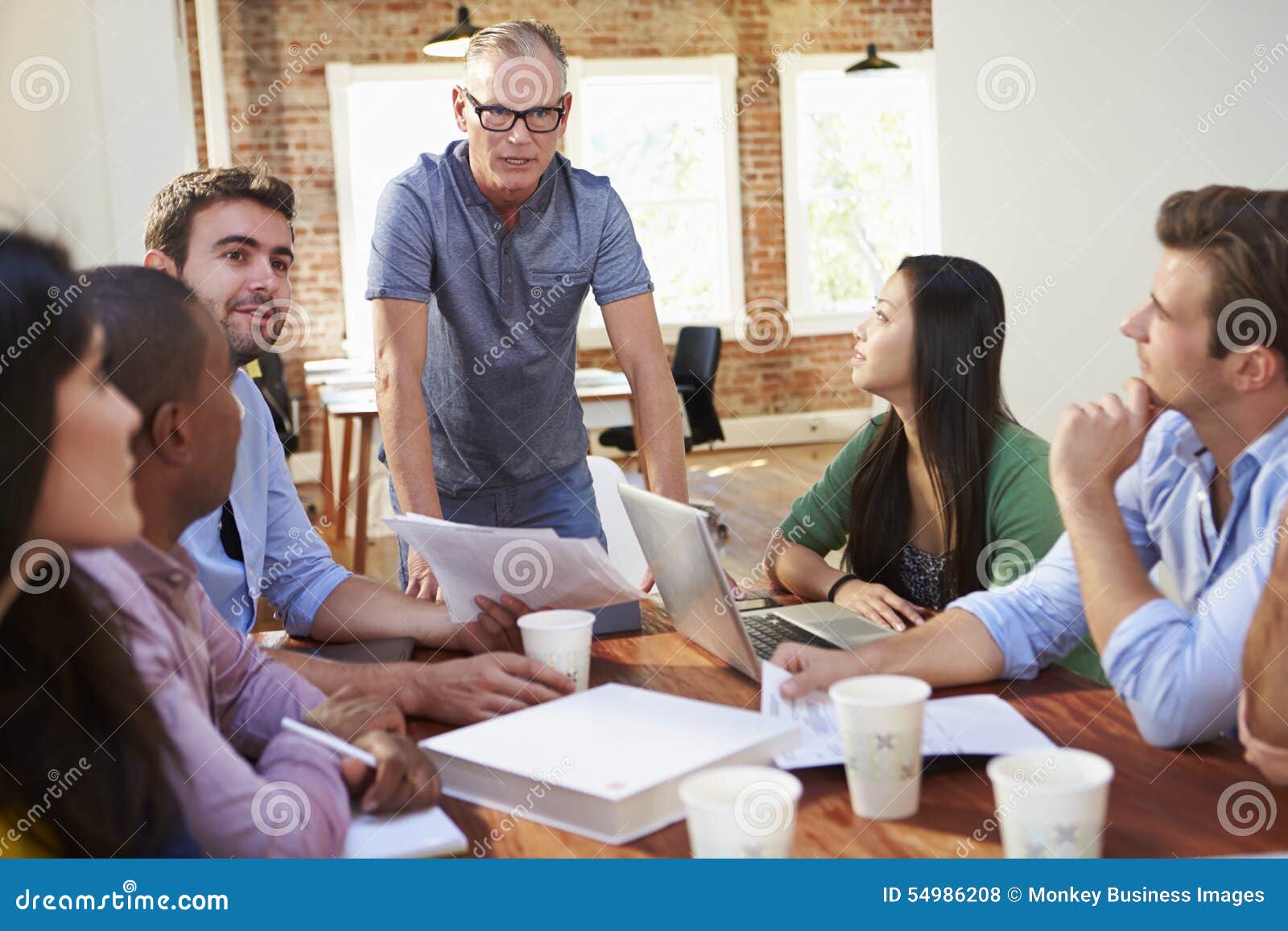Group of Office Workers Meeting To Discuss Ideas Stock Photo - Image of ...