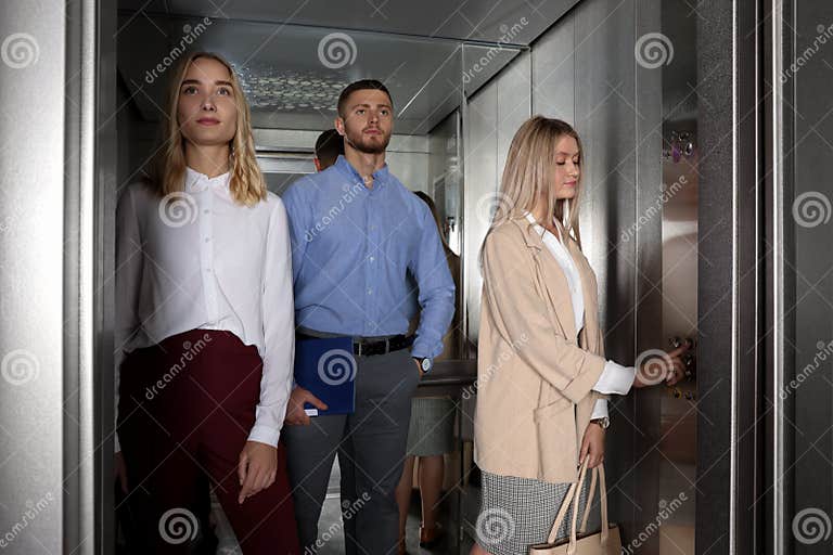 Group of Office Workers in Modern Elevator Stock Image - Image of group ...