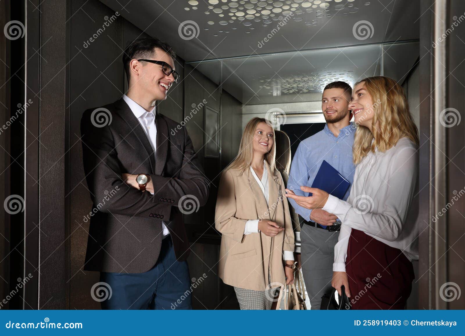 Group of Office Workers Talking in Modern Elevator Stock Image - Image ...