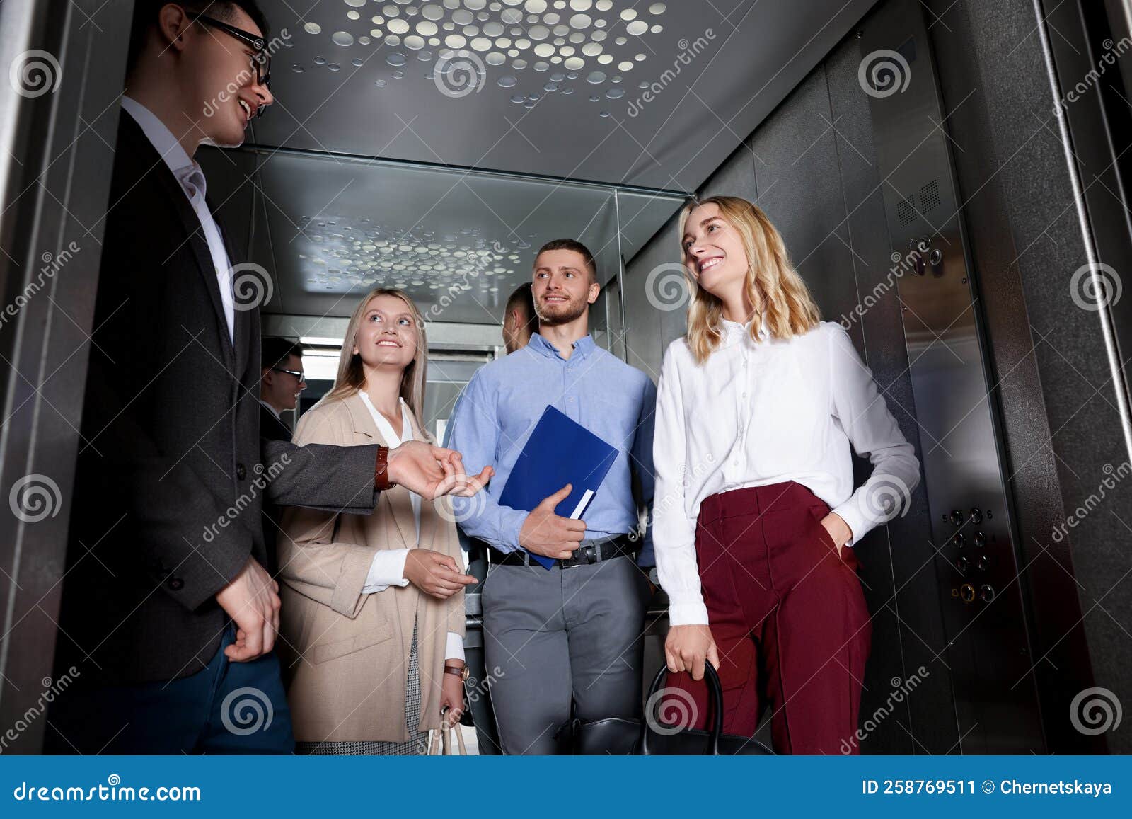Group of Office Workers Talking in Modern Elevator Stock Image - Image of apartment, angle ...