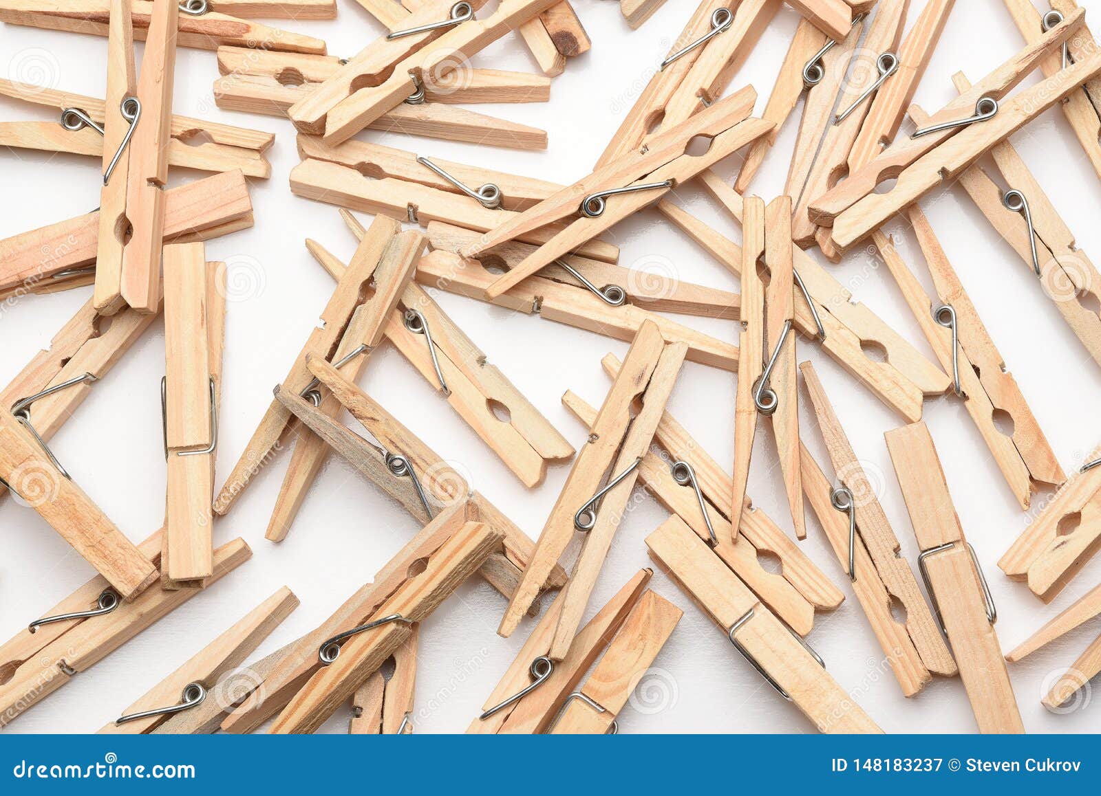 A Group of Old Fashioned Wooden Clothes Pins on a White Surface Stock ...