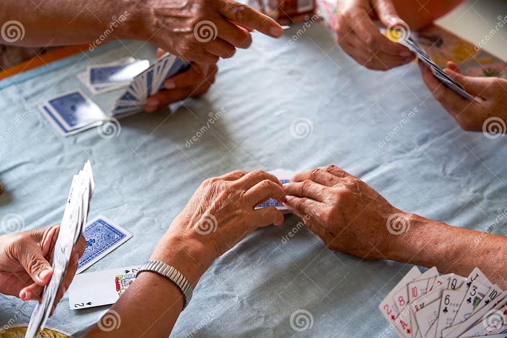 A Group of Old People Sit Around and Play Poker Card Stock Photo ... A Group of Old People Sit Around and Play Poker Card Stock Photo ...
