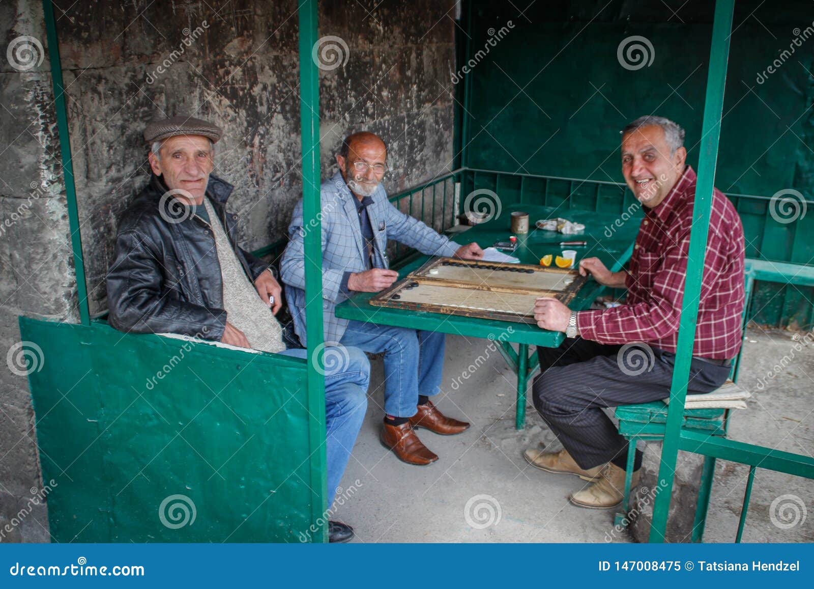 A Group Of Older Men Bowing To The Ground While Praying In The Temple ...