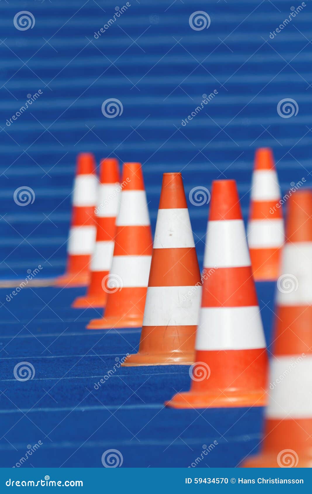 Group of Orange Cones on Blue Background Stock Photo - Image of symbol ...