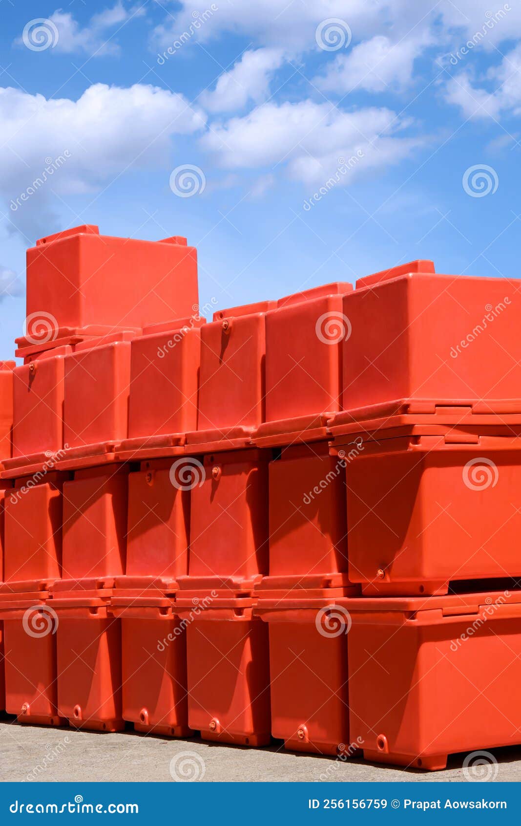 Group of Orange Foldable Ice Buckets Stack on Courtyard Outside of ...