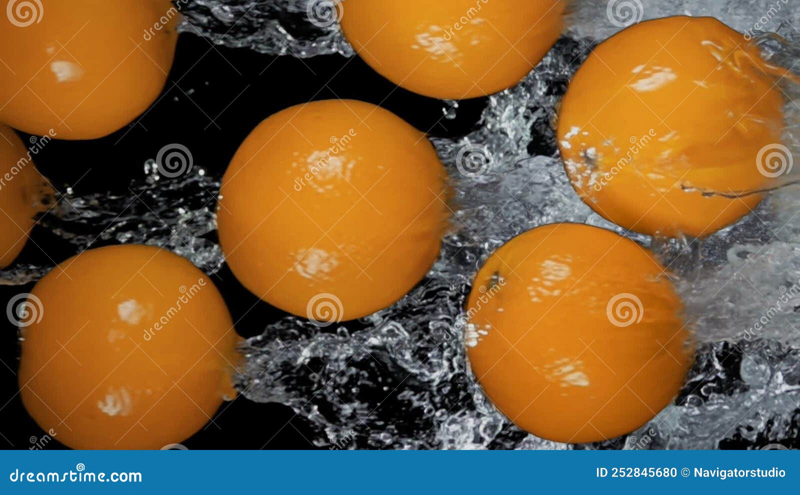 Group of Oranges is Bouncing Horizontally with Splashes on the Black ...