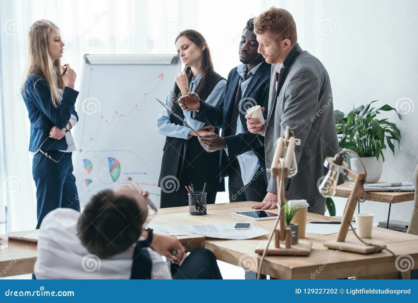 Group of Overworked Managers Having Conversation Stock Photo - Image of ...