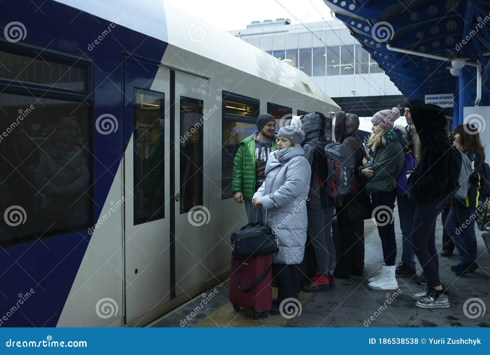 Group of Passengers Standing in Front of Doors of the Passenger Train ...