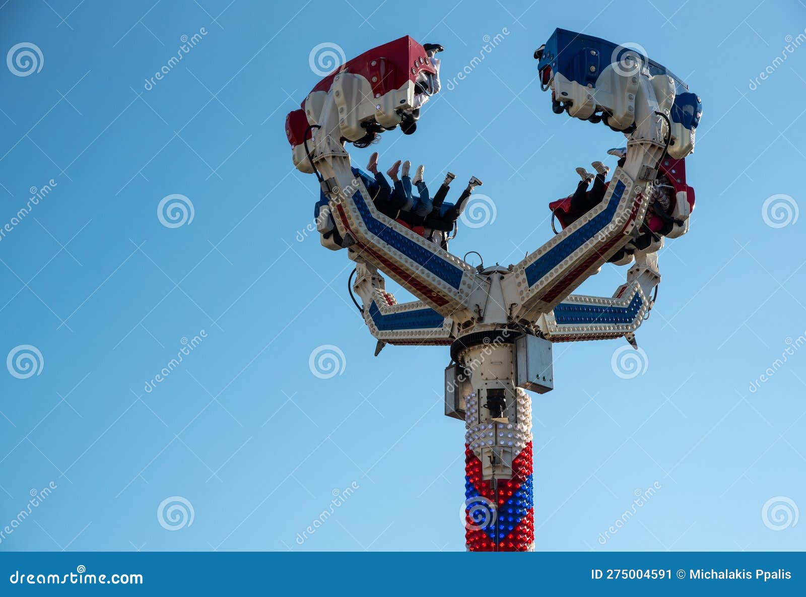 Group of People on a Amusement Park Game Spinning in the Sky. Having ...