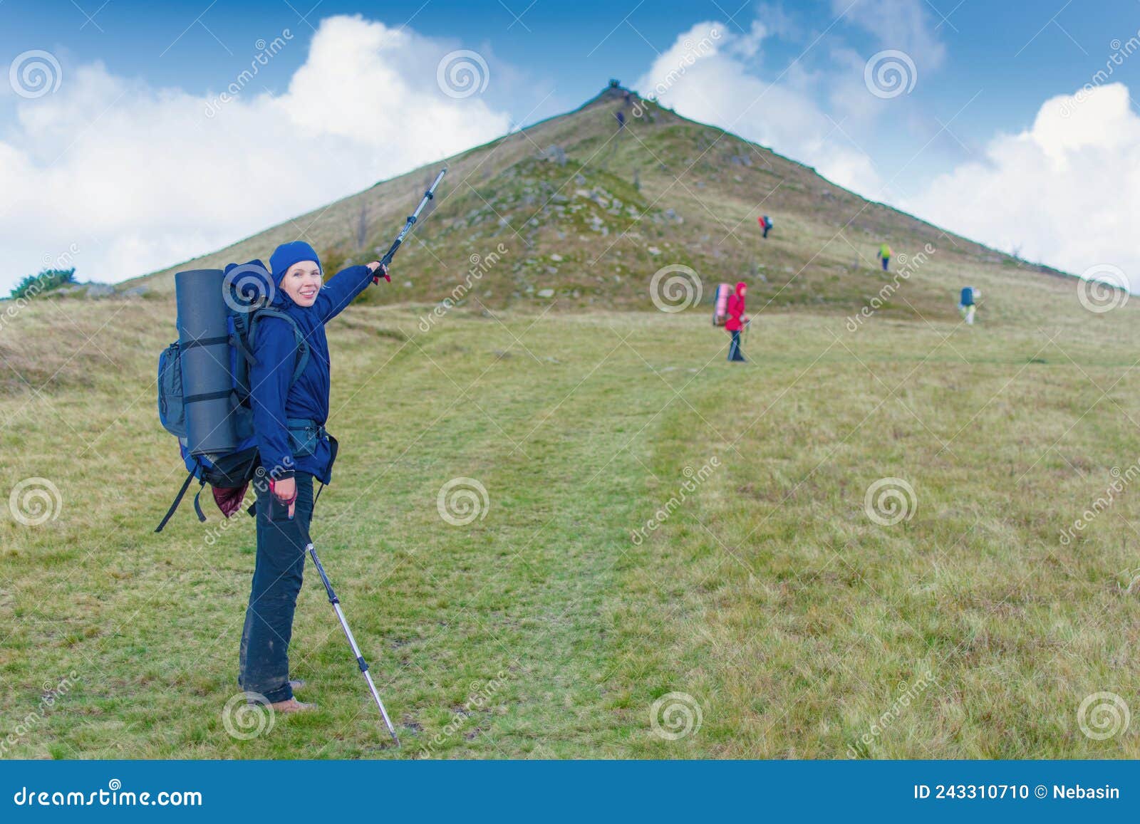 A Group of People with Backpacks Hiking in the Mountains Stock Photo ...