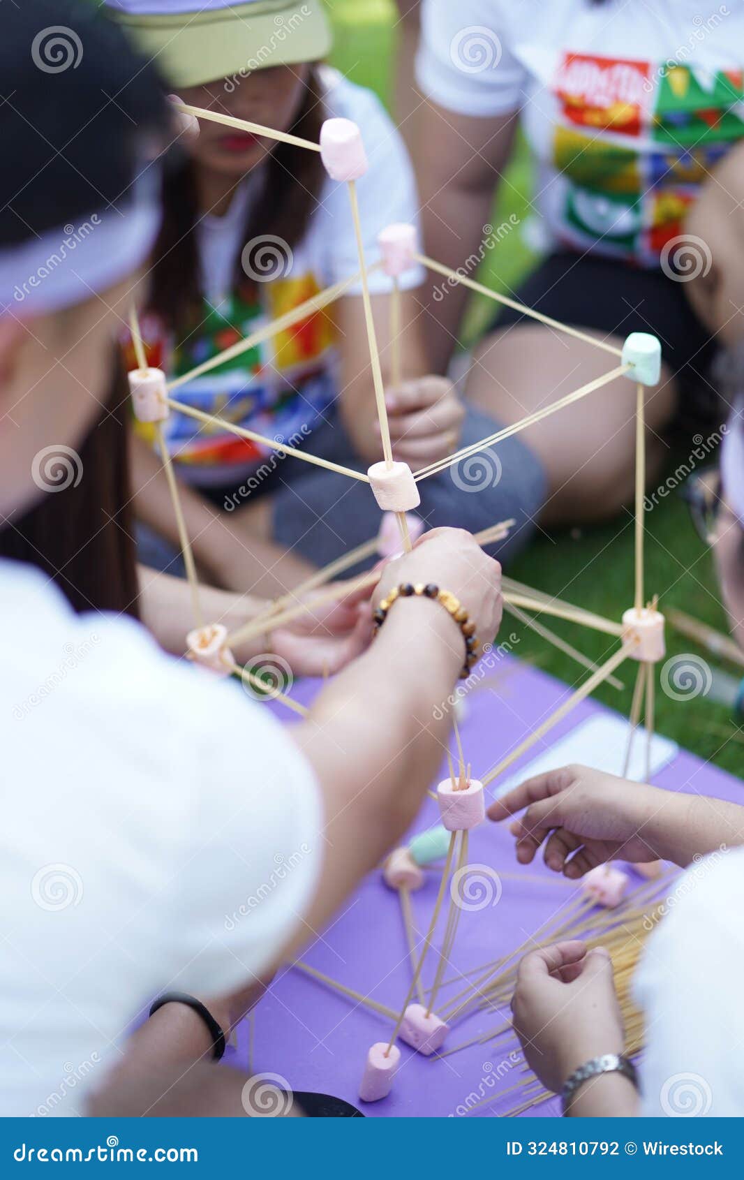 Group of People Constructing a Structure with Marshmallows and ...