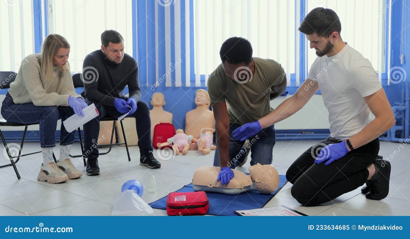 Group of People CPR First Aid Training Course. CPR Teen Dummy First Aid ...