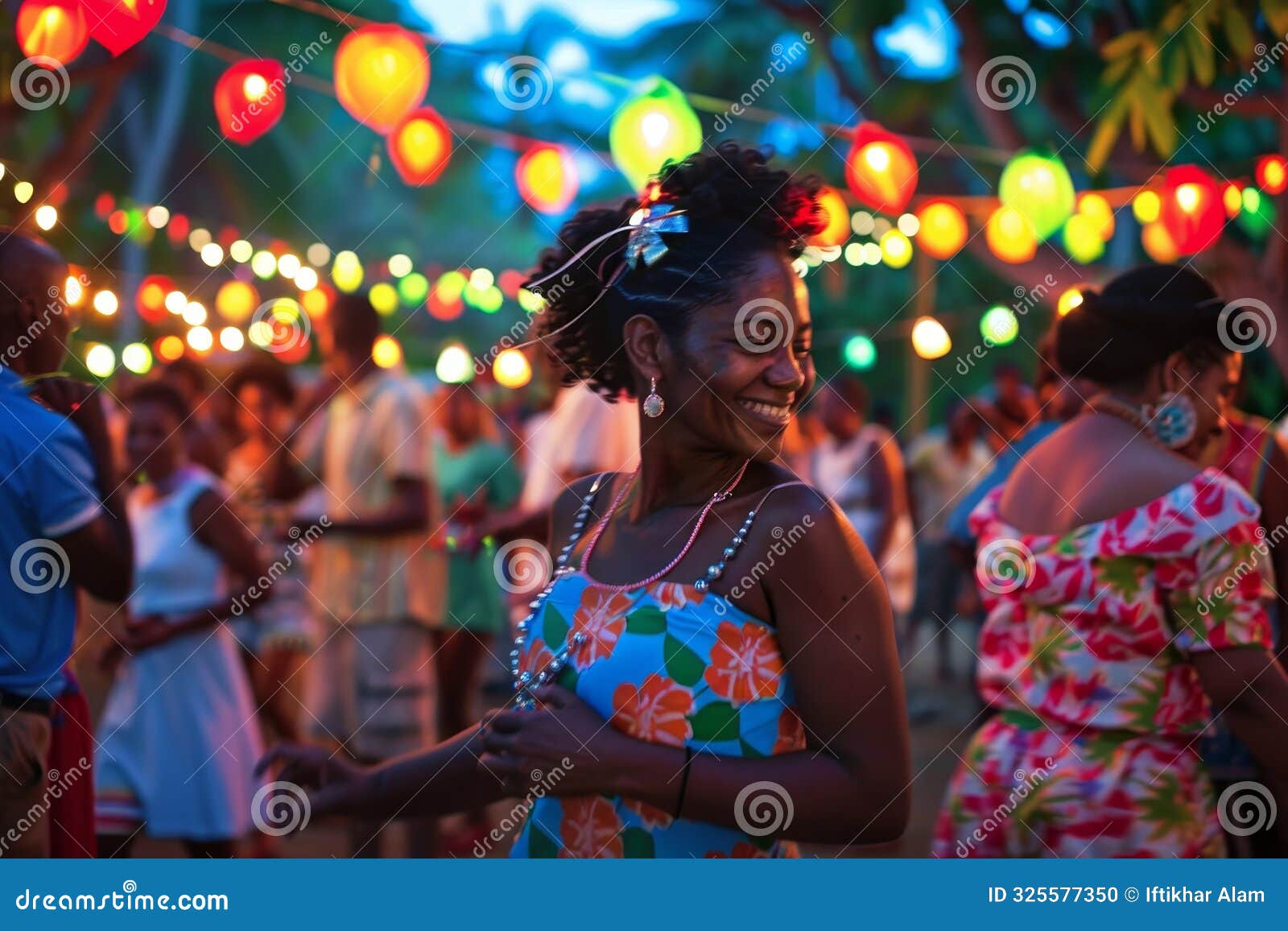 A Group of People Dance and Sing Under Brightly Colored String Lights ...