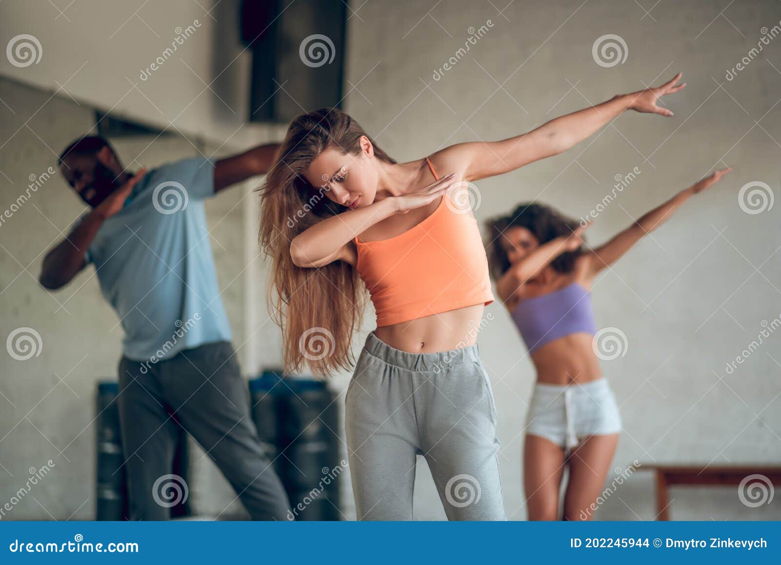 Group of People Dancing Synchronized Choreography Together Stock Photo ...