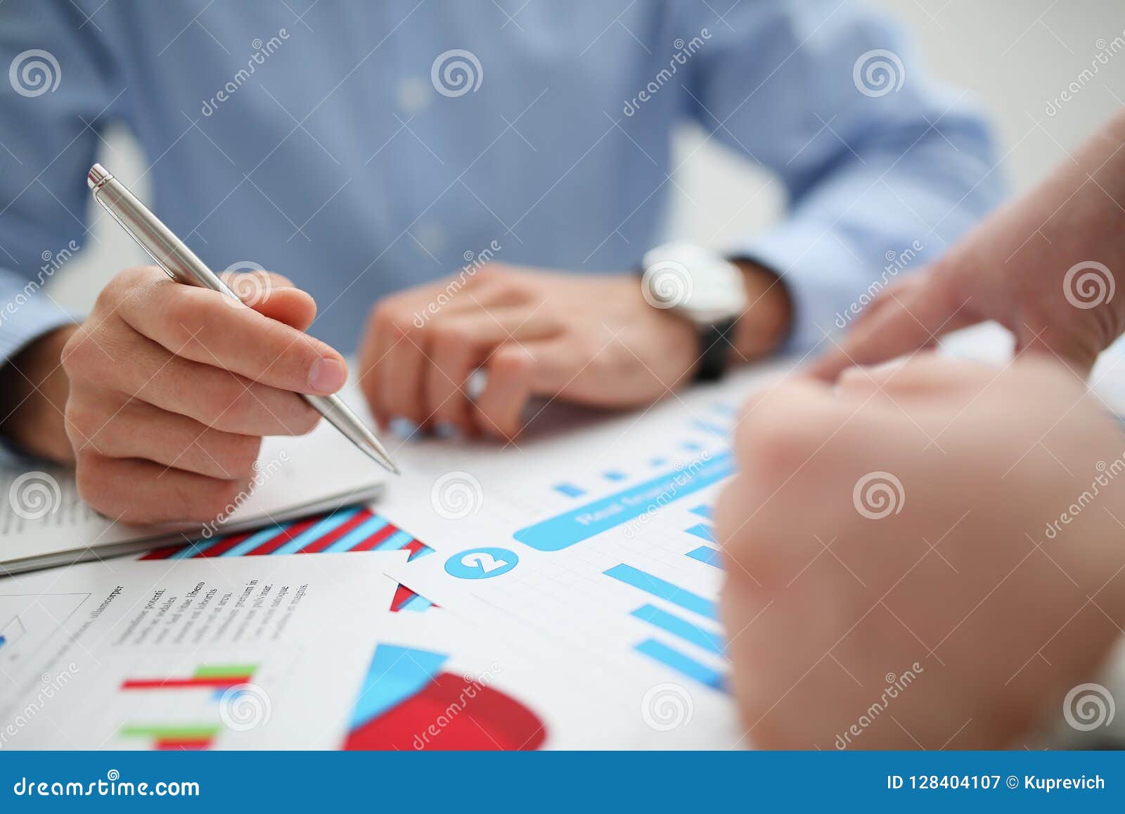 Group of People Deliberate on Problem with Infographics Stock Image ...